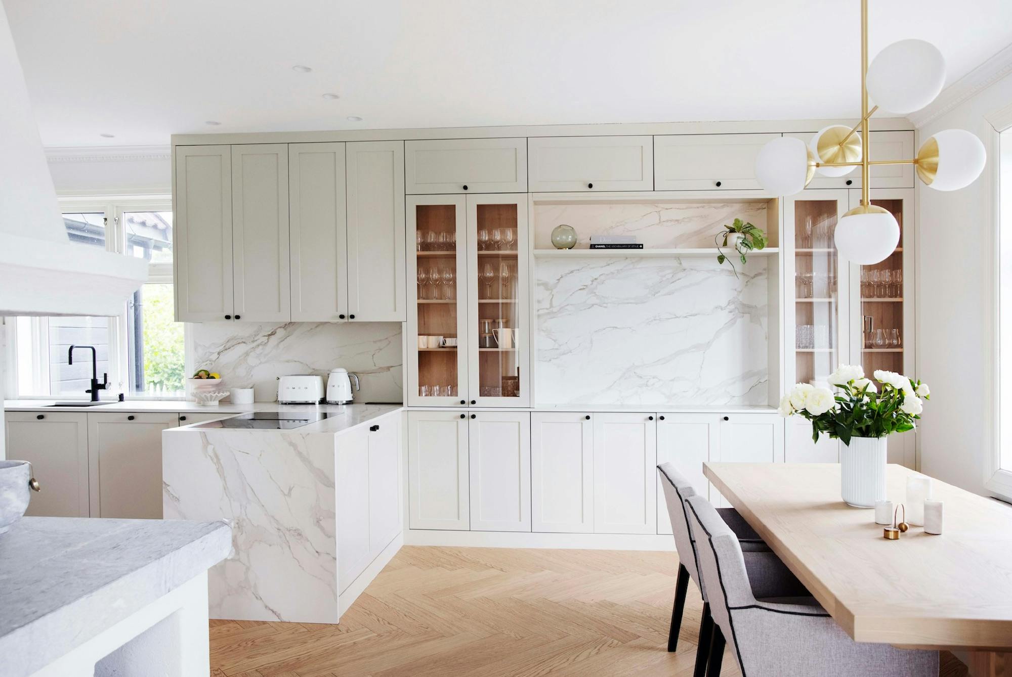 Dekton Arga creates an elegant atmosphere in this open plan kitchen ...