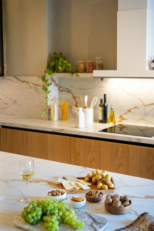 A spacious, modern and organic kitchen featuring wood and Dekton ...