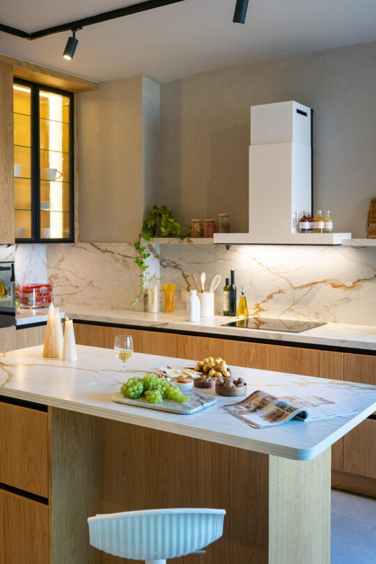 A spacious, modern and organic kitchen featuring wood and Dekton ...