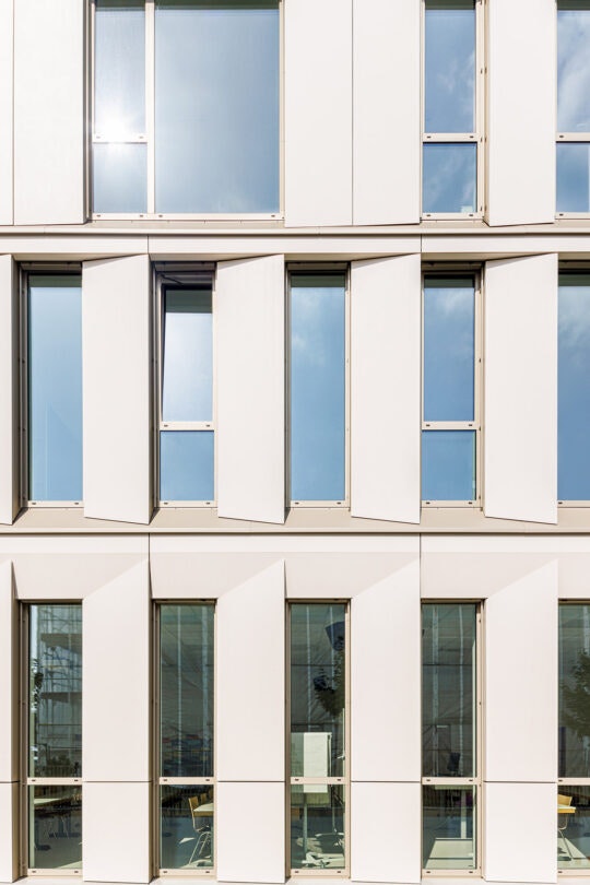 Only two façade elements (recessed windows and slanted Dekton panels ...