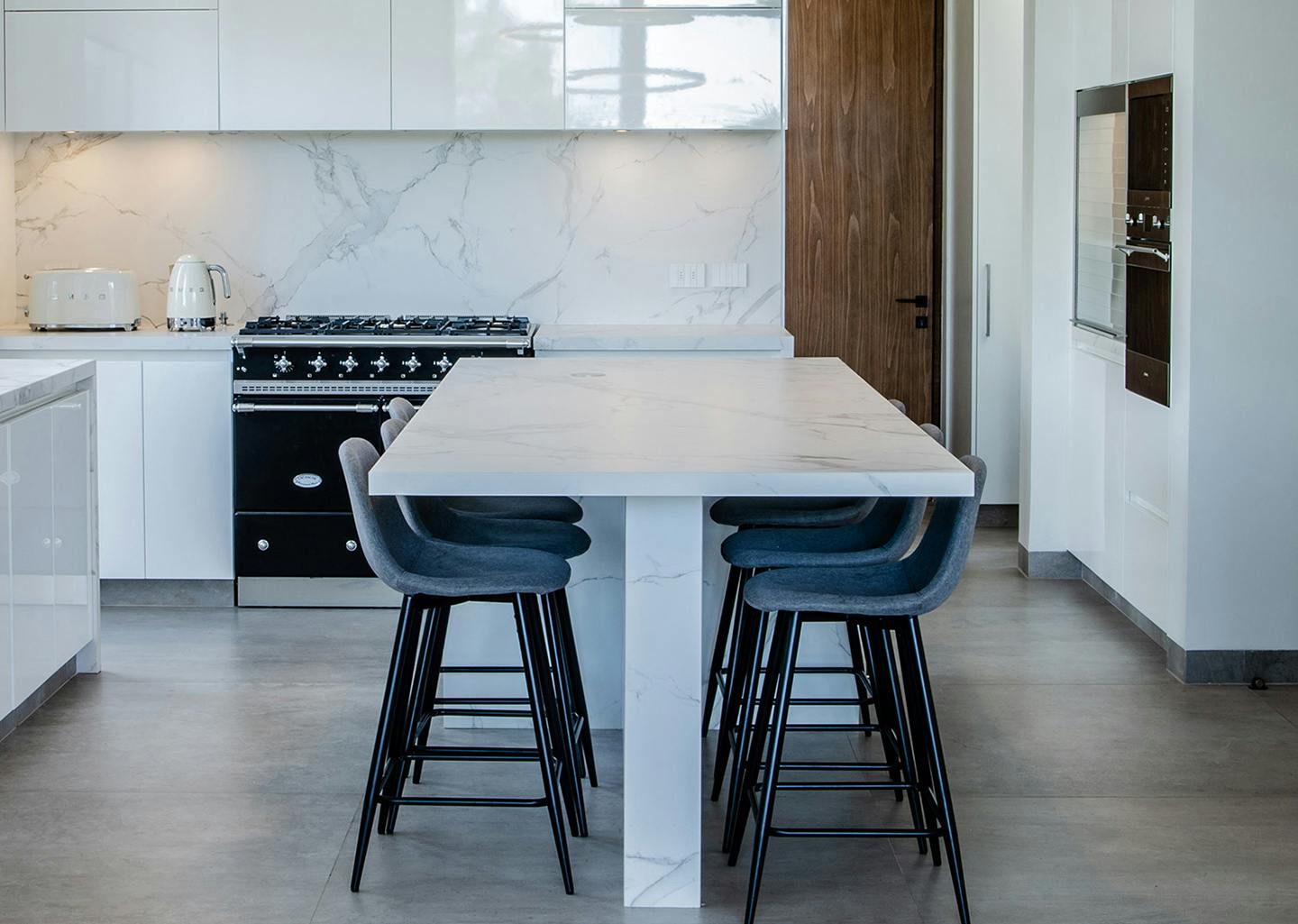 Custom-made Dekton tables and countertops dress up this Japandi-style ...
