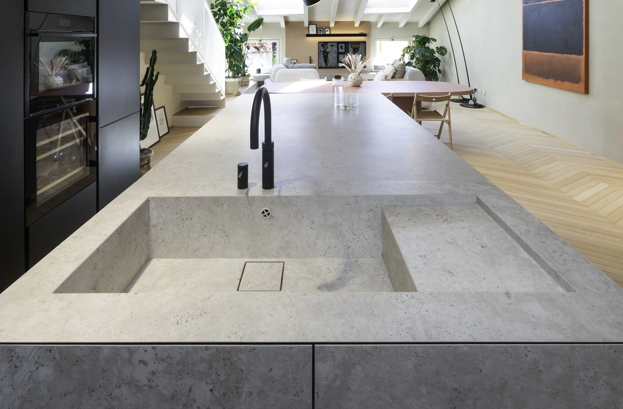 This monolithic, sculptural and minimalist island conceals an entire ...