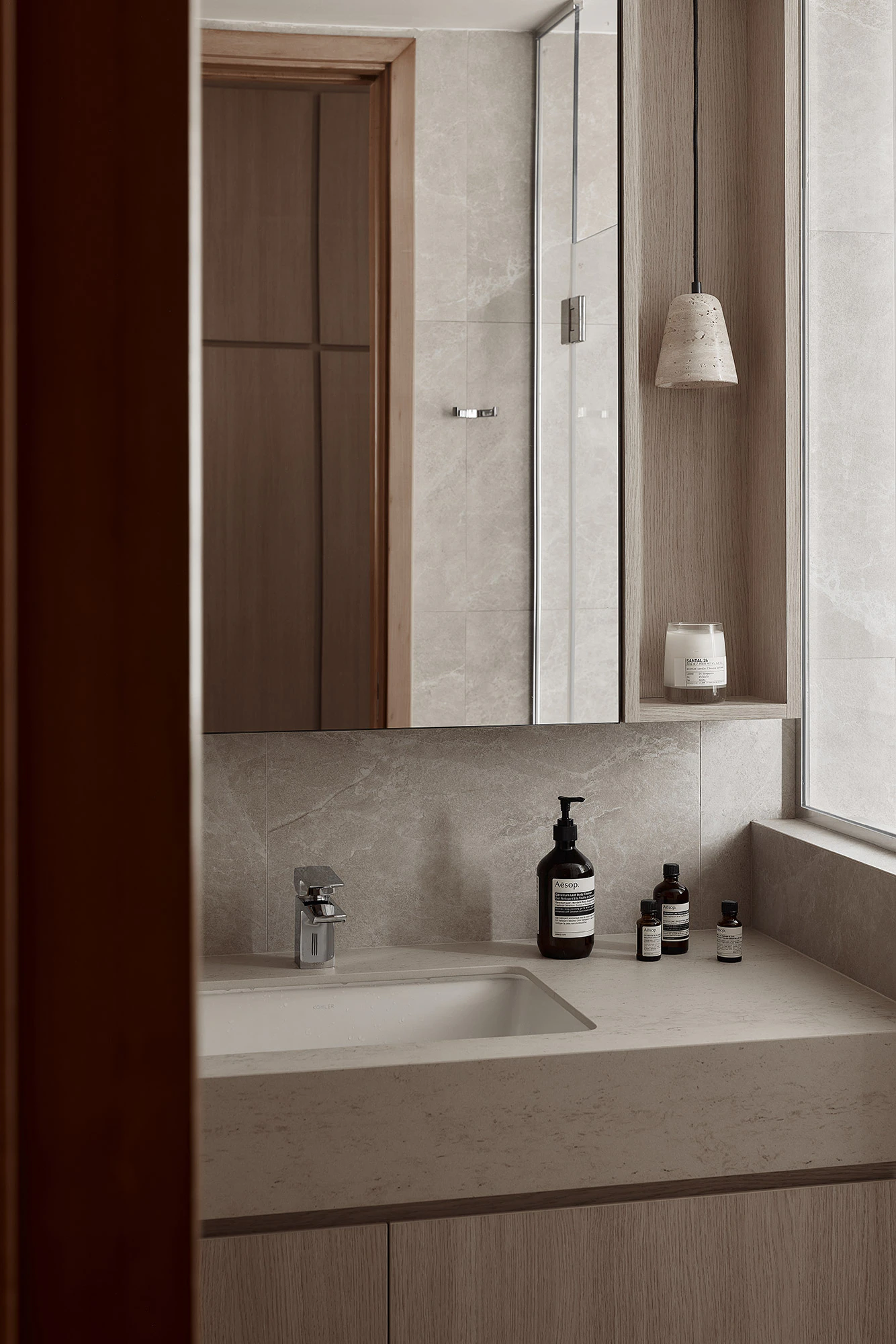 A minimalist home with earthy tones harmoniously blended with Dekton ...