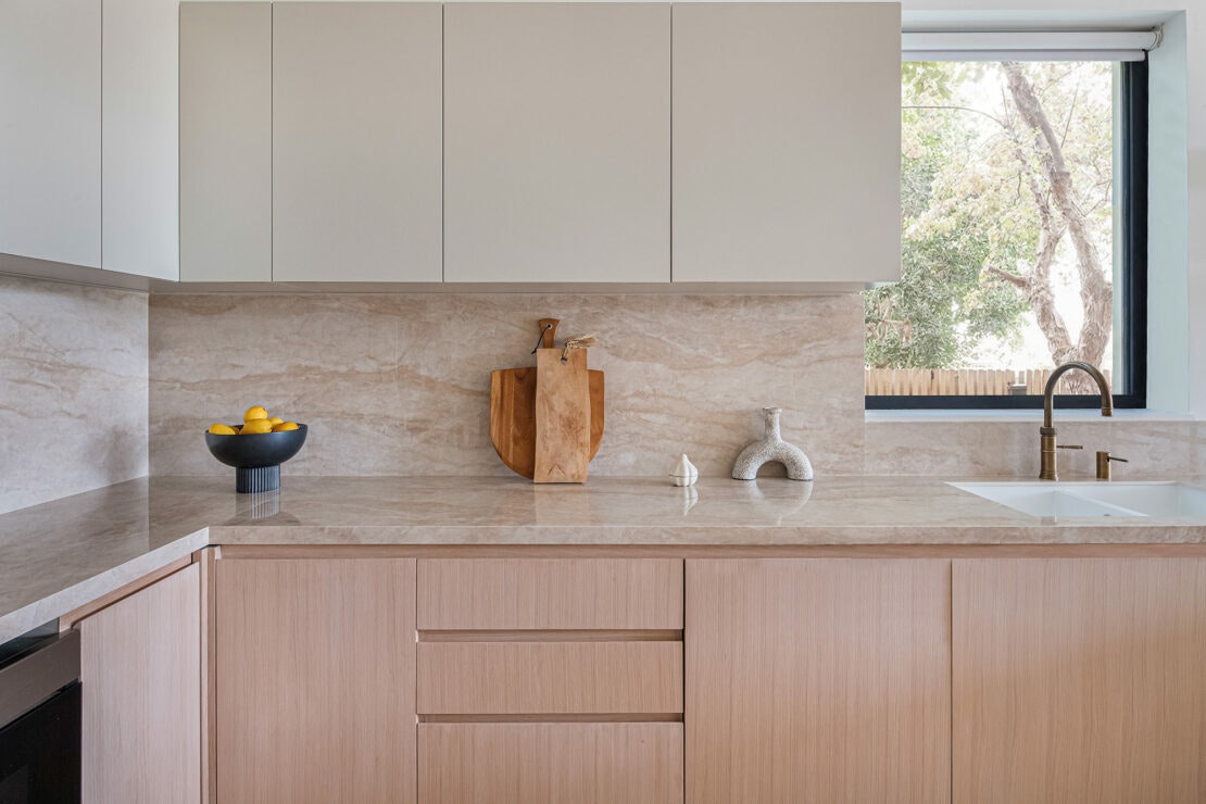 Dekton Arga creates an elegant atmosphere in this open plan kitchen ...