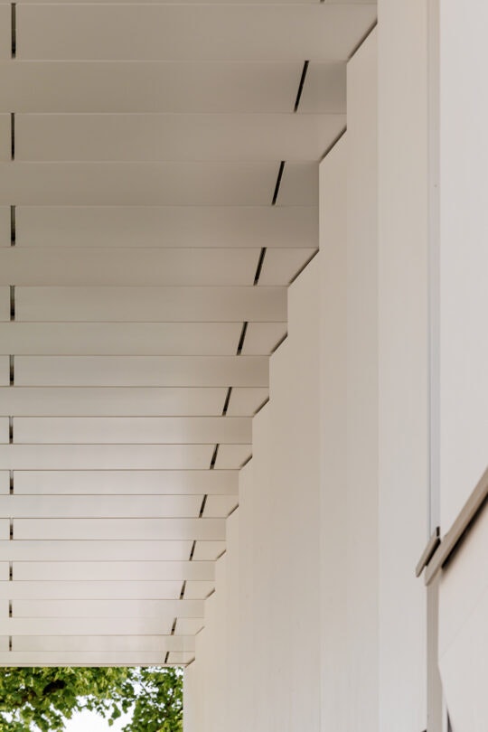 Only two façade elements (recessed windows and slanted Dekton panels ...