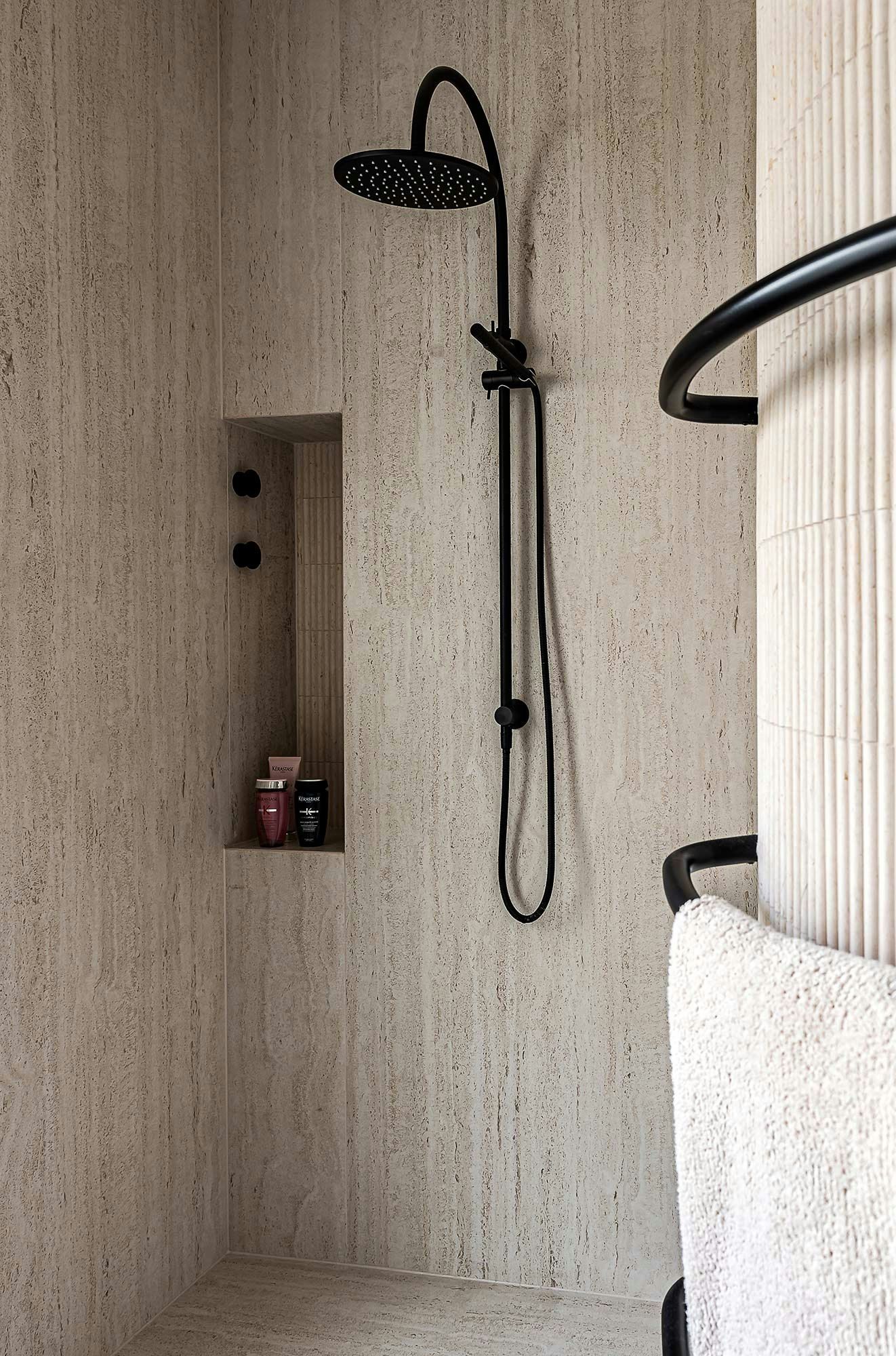 Natural light partners with Dekton Marmorio to create an enveloping, sophisticated bathroom ...