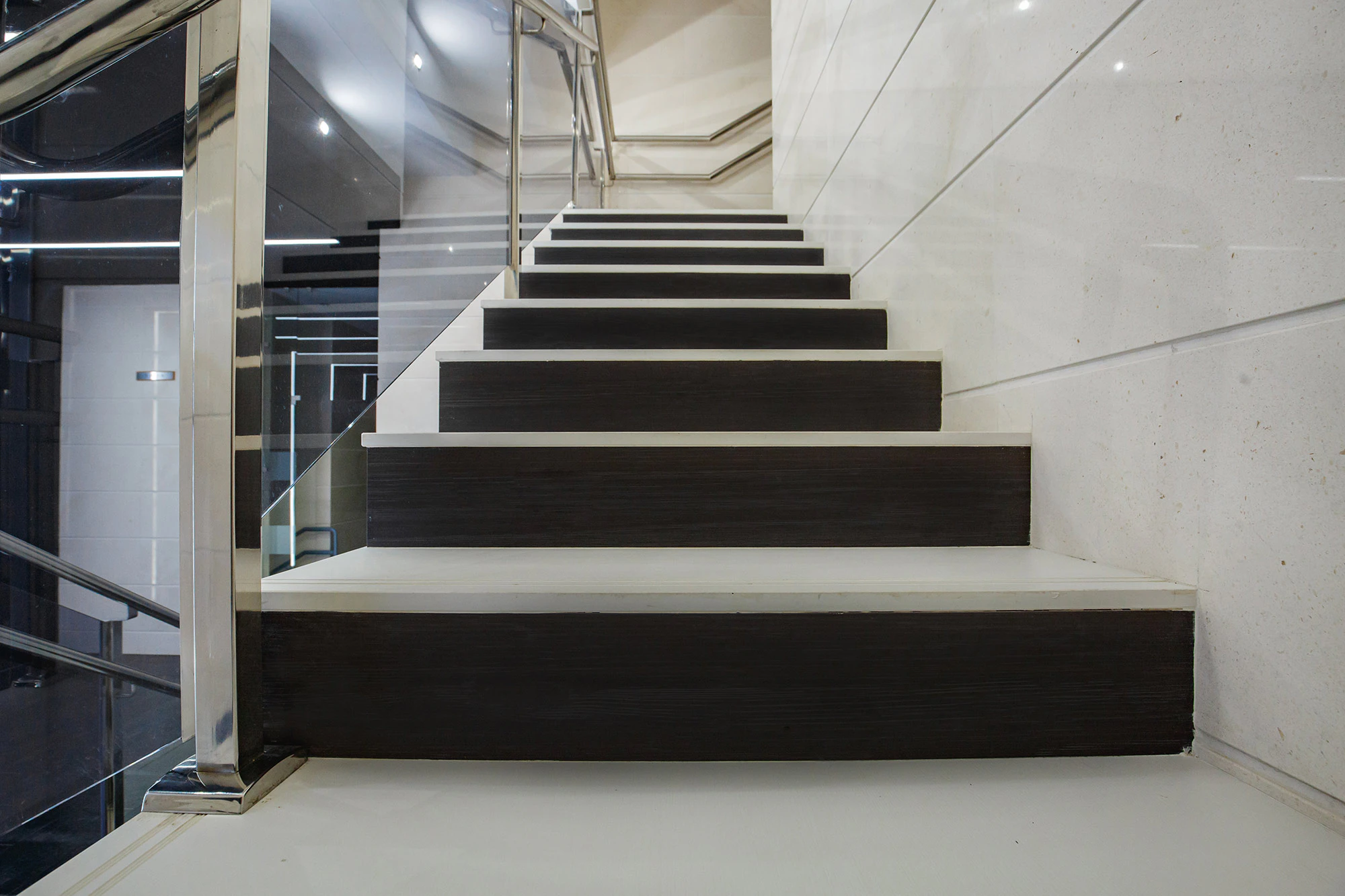 A black and white residential building featuring Dekton for a ...
