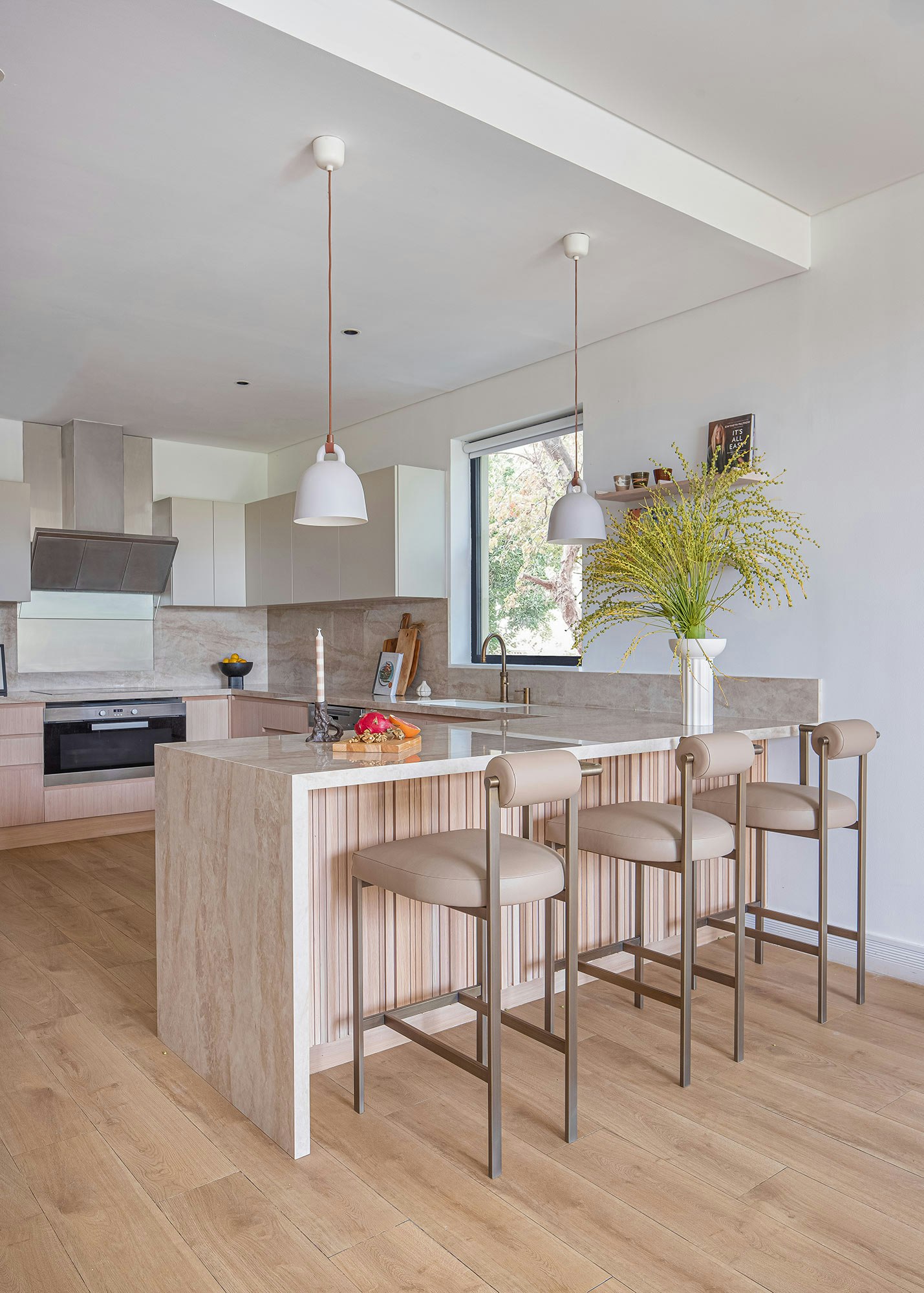 Dekton Arga creates an elegant atmosphere in this open plan kitchen ...