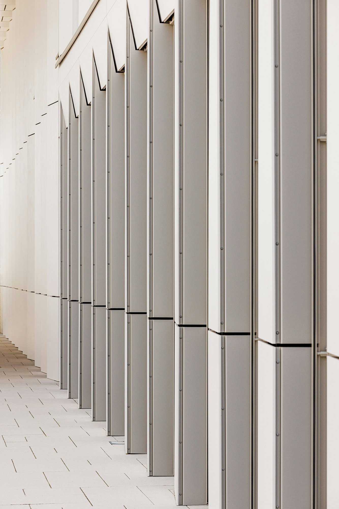 Only two façade elements (recessed windows and slanted Dekton panels ...