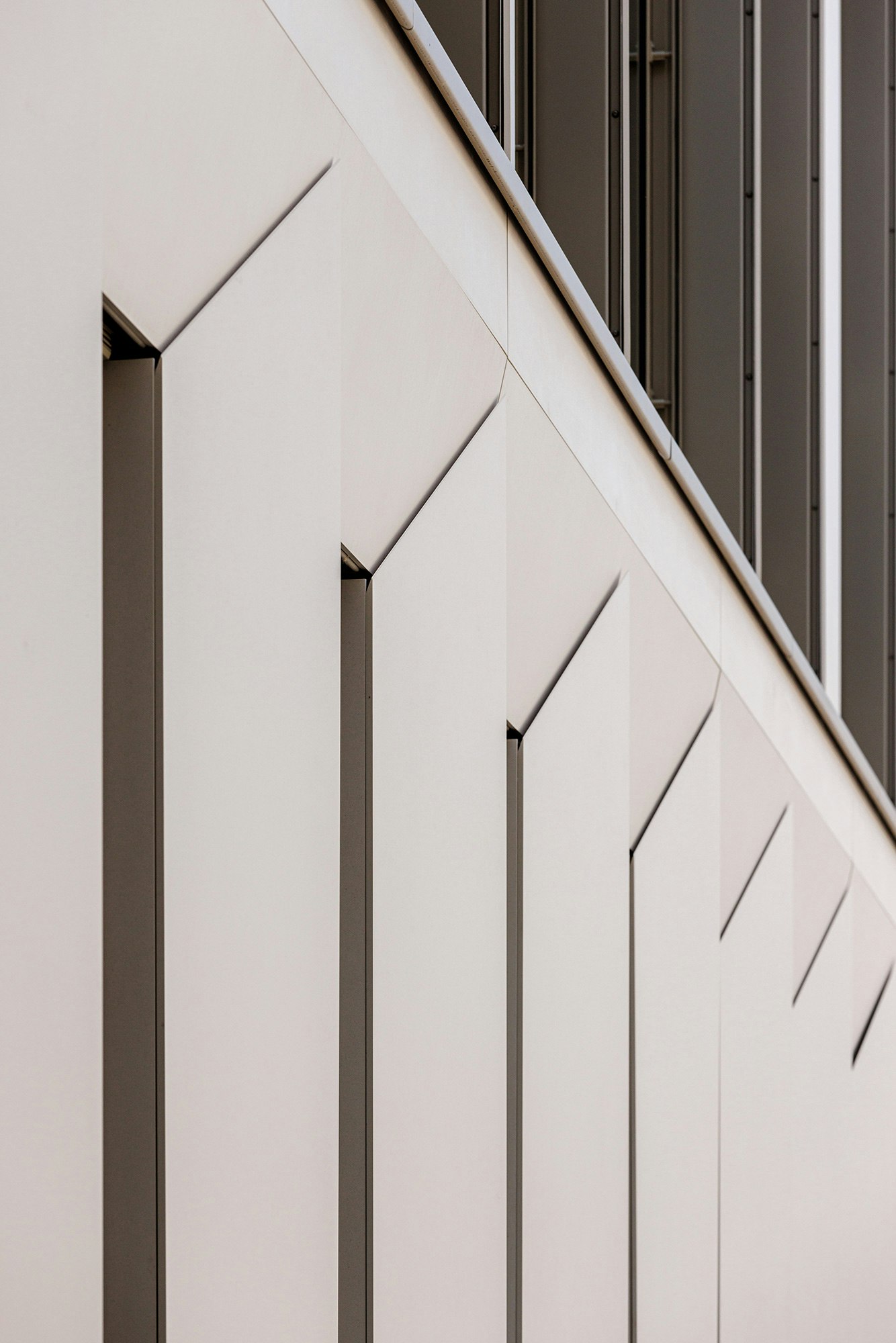 Only two façade elements (recessed windows and slanted Dekton panels ...