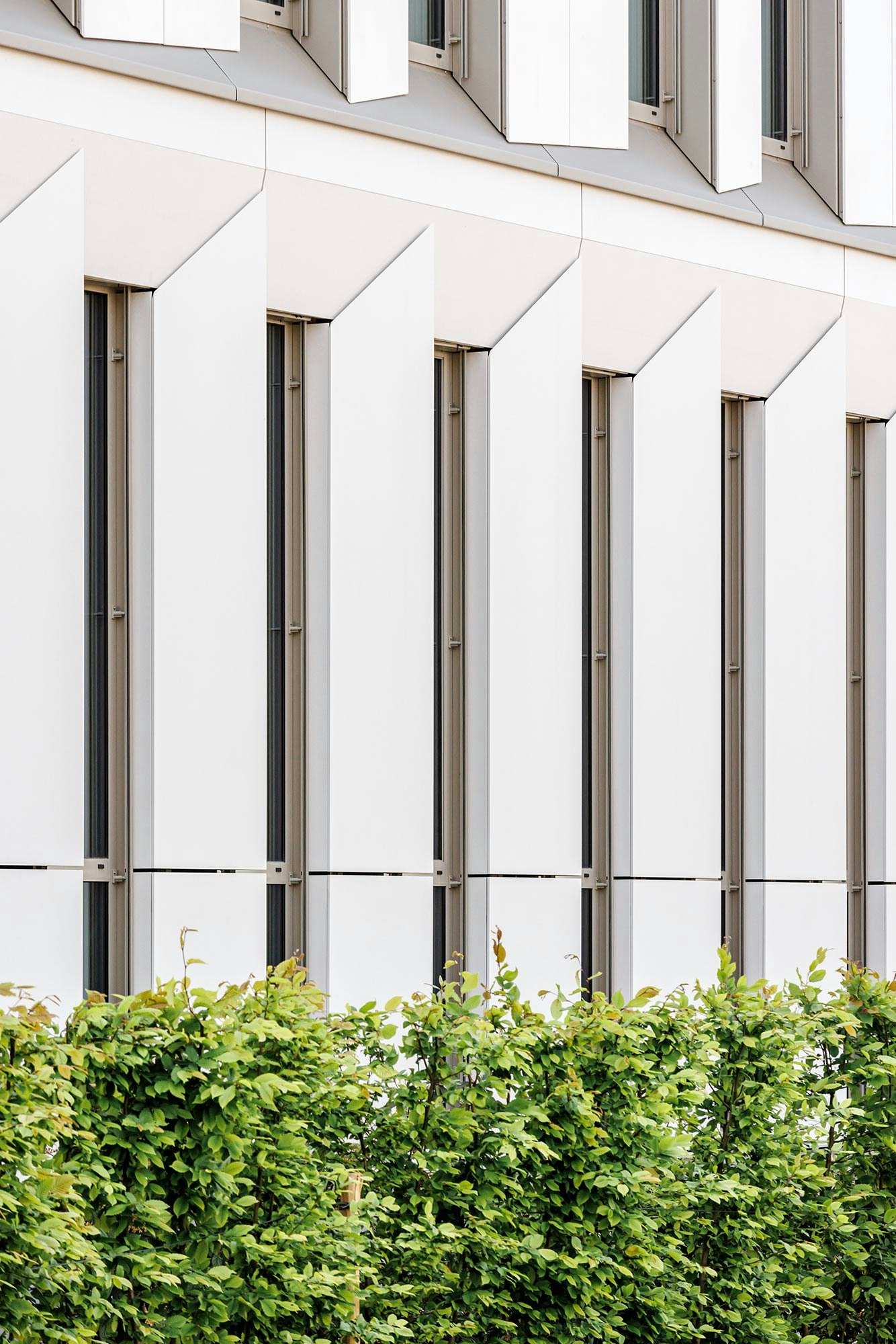 Only two façade elements (recessed windows and slanted Dekton panels ...