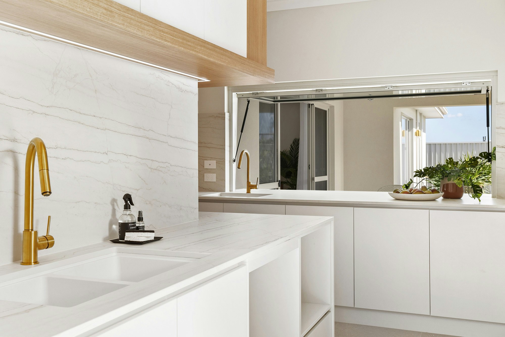 The warmth of the wood and Cosentino materials is the hallmark of this ...