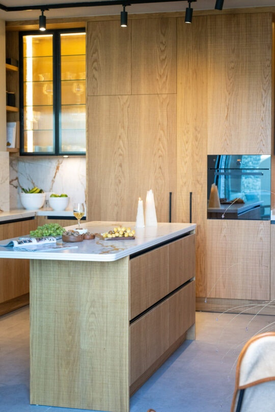 A spacious, modern and organic kitchen featuring wood and Dekton ...