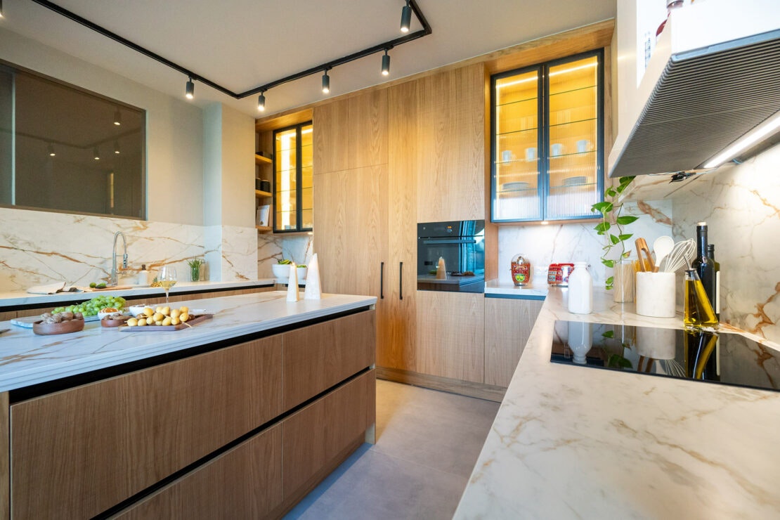 A spacious, modern and organic kitchen featuring wood and Dekton ...