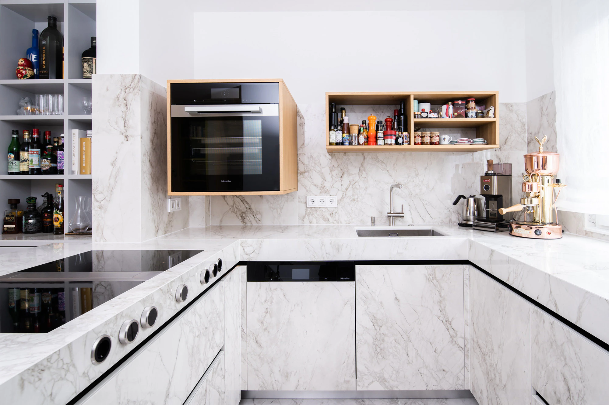 A black and white residential building featuring Dekton for a ...