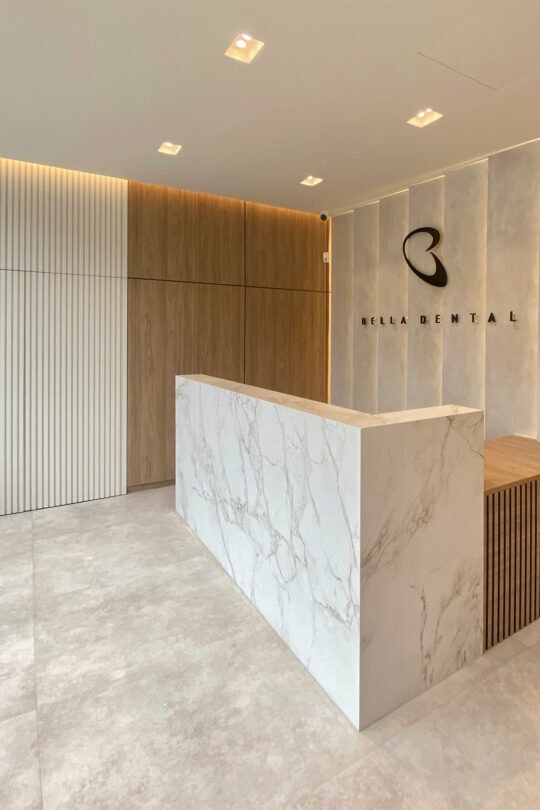 A Dekton reception desk to mark the decoration of a high quality dental ...