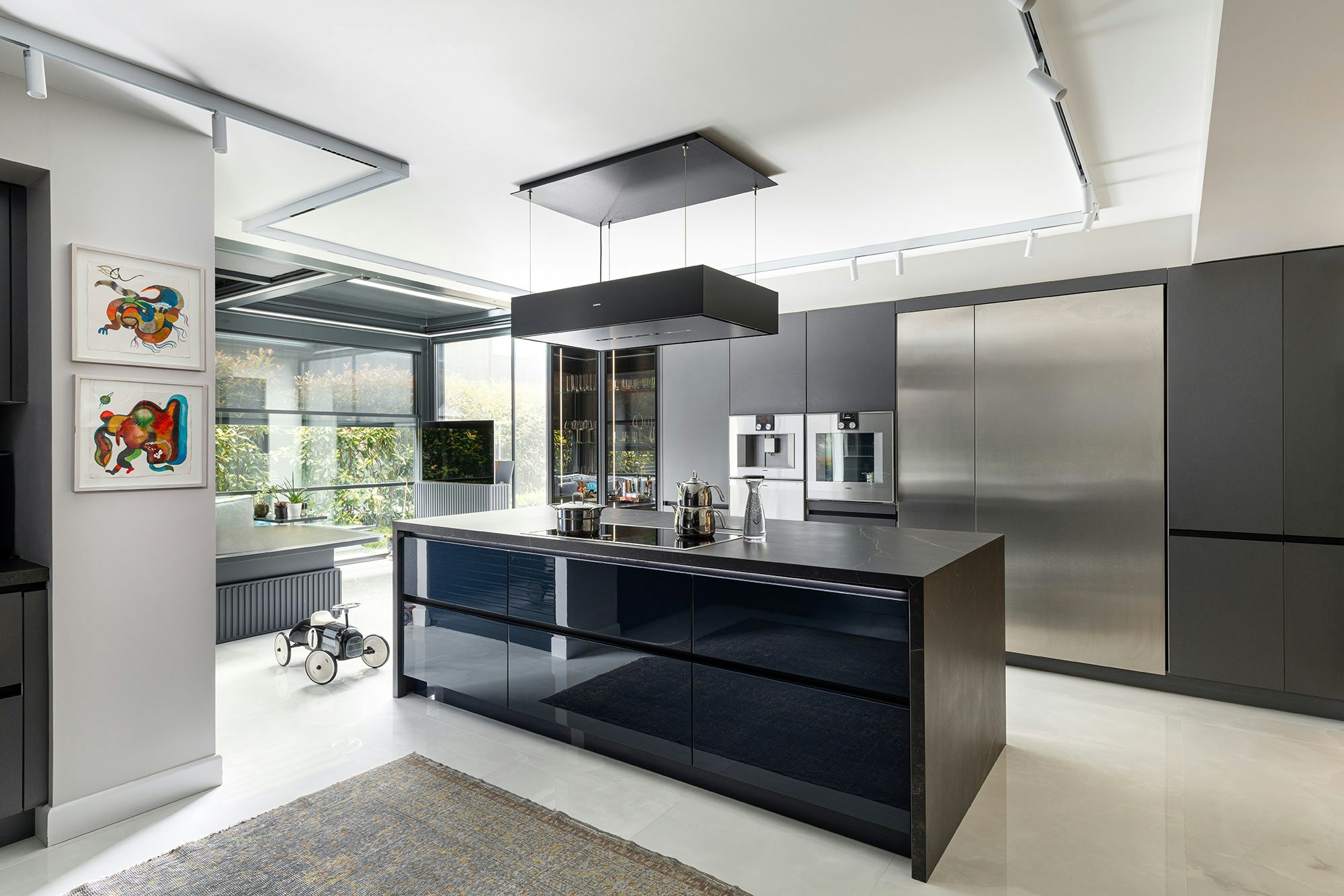 Dekton Arga creates an elegant atmosphere in this open plan kitchen ...